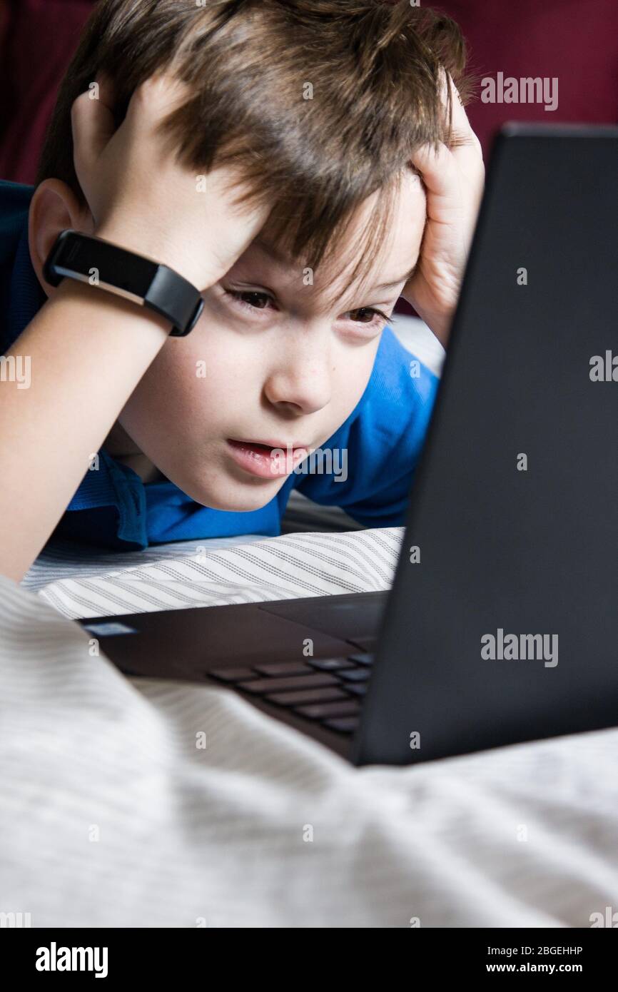 Shocked and surprised boy with laptop learning online. shock content ...