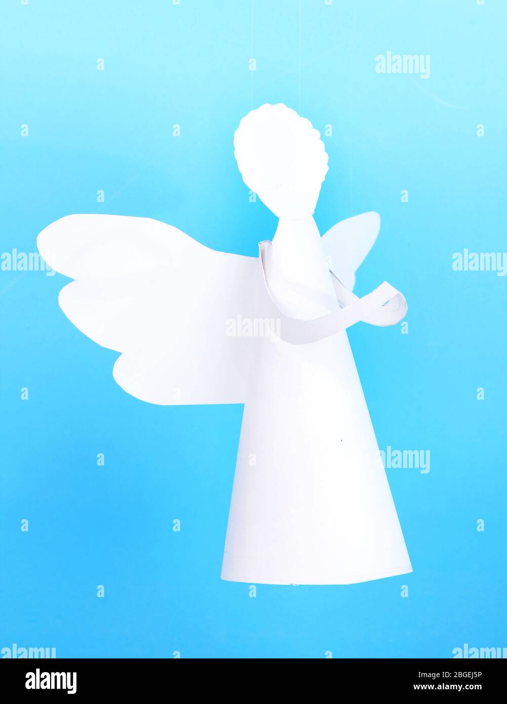 Angel paper on blue background hi-res stock photography and images - Alamy