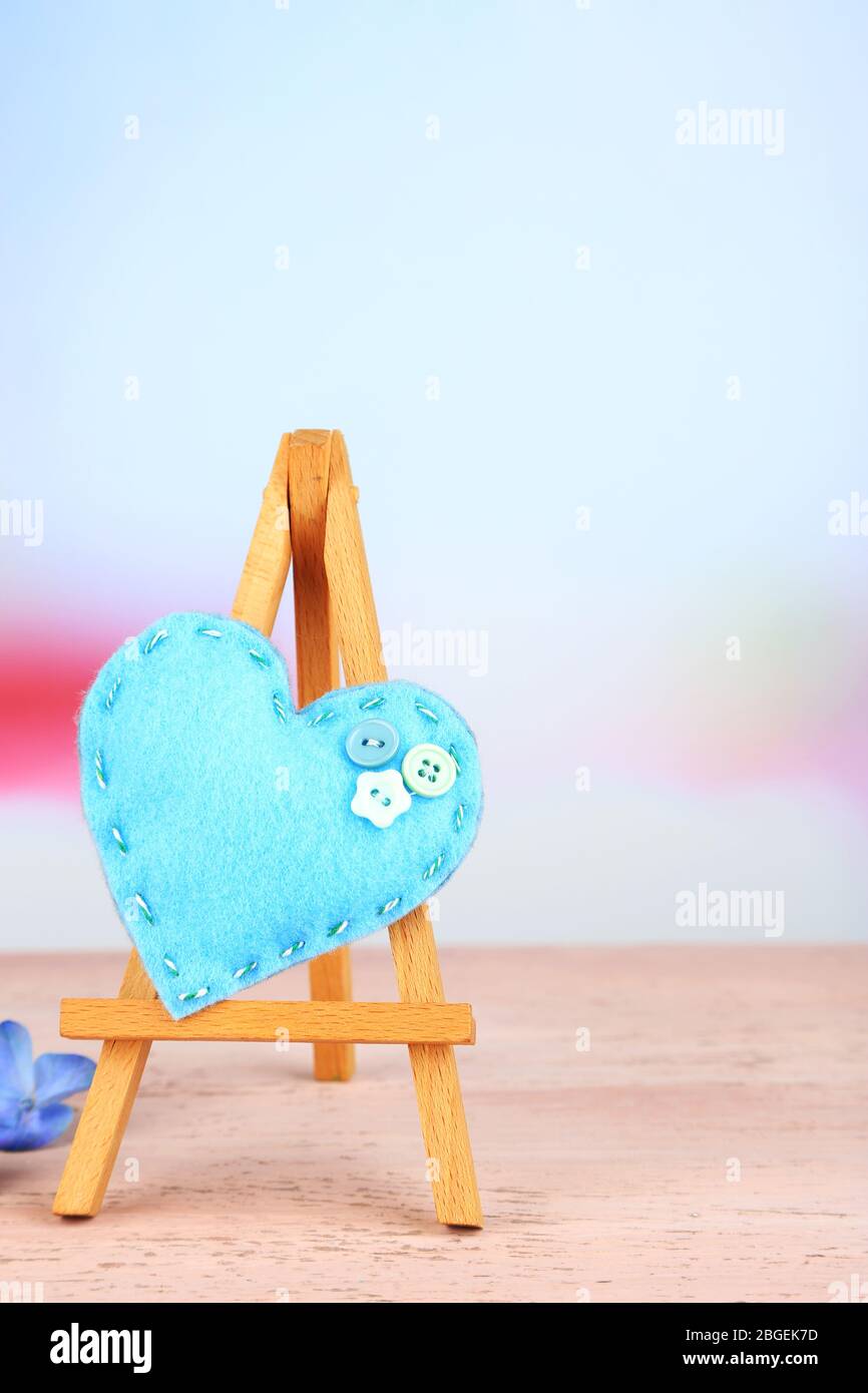 Beautiful heart small decorative easel on pink table Stock Photo - Alamy