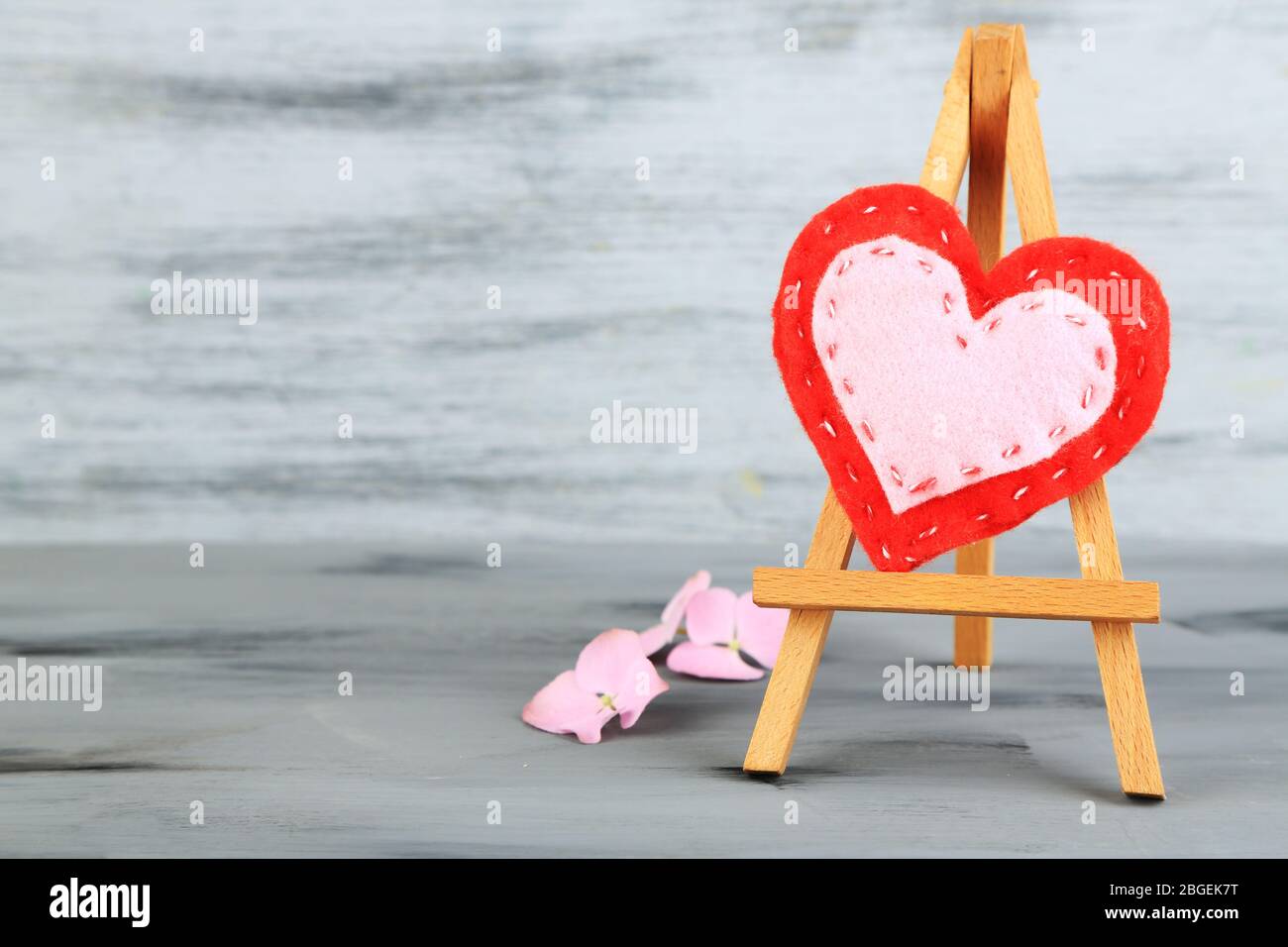Beautiful heart small decorative easel on grey background Stock Photo ...