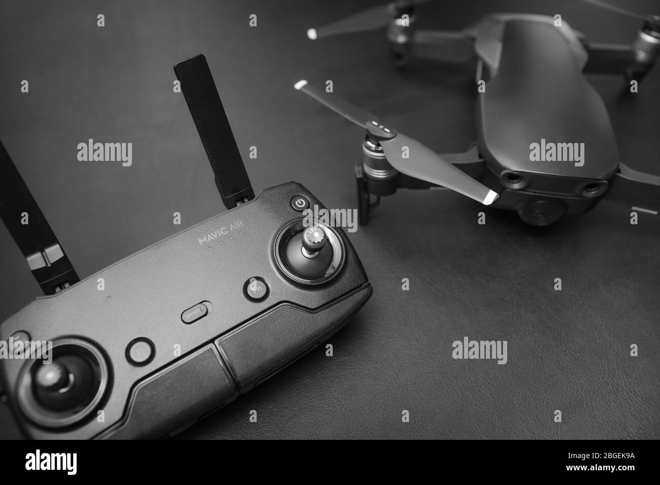 Modern quadrocopter or drone on the table with the image of a world map ...