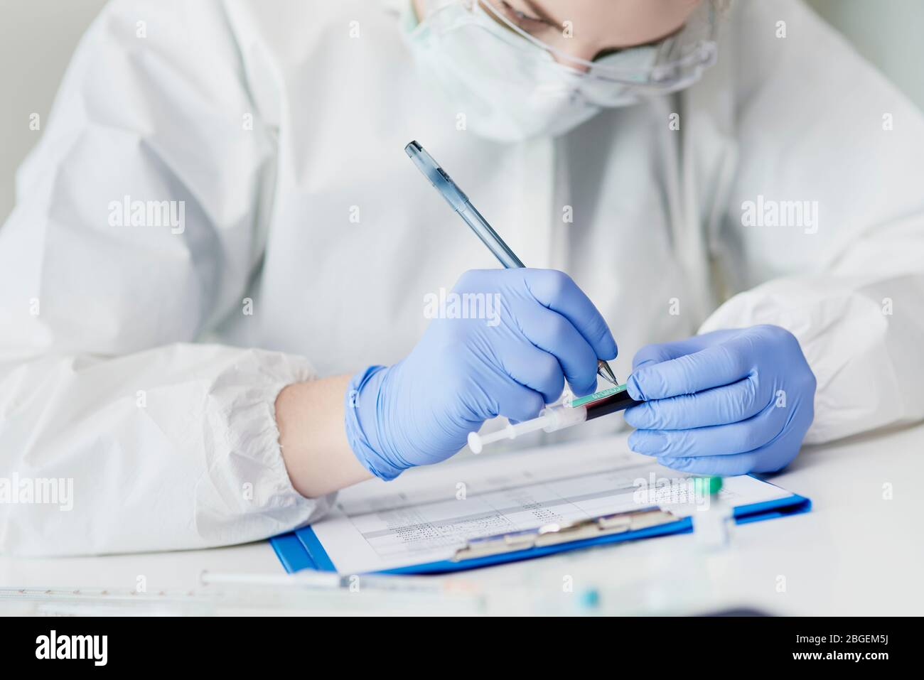Technician making medical exams in the laboratory Stock Photo - Alamy