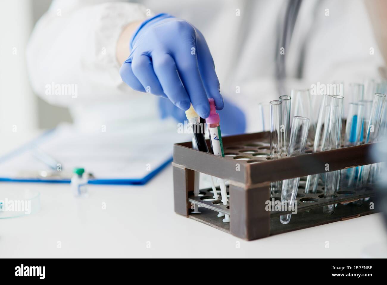 Desk at laboratory with test tubes Stock Photo - Alamy