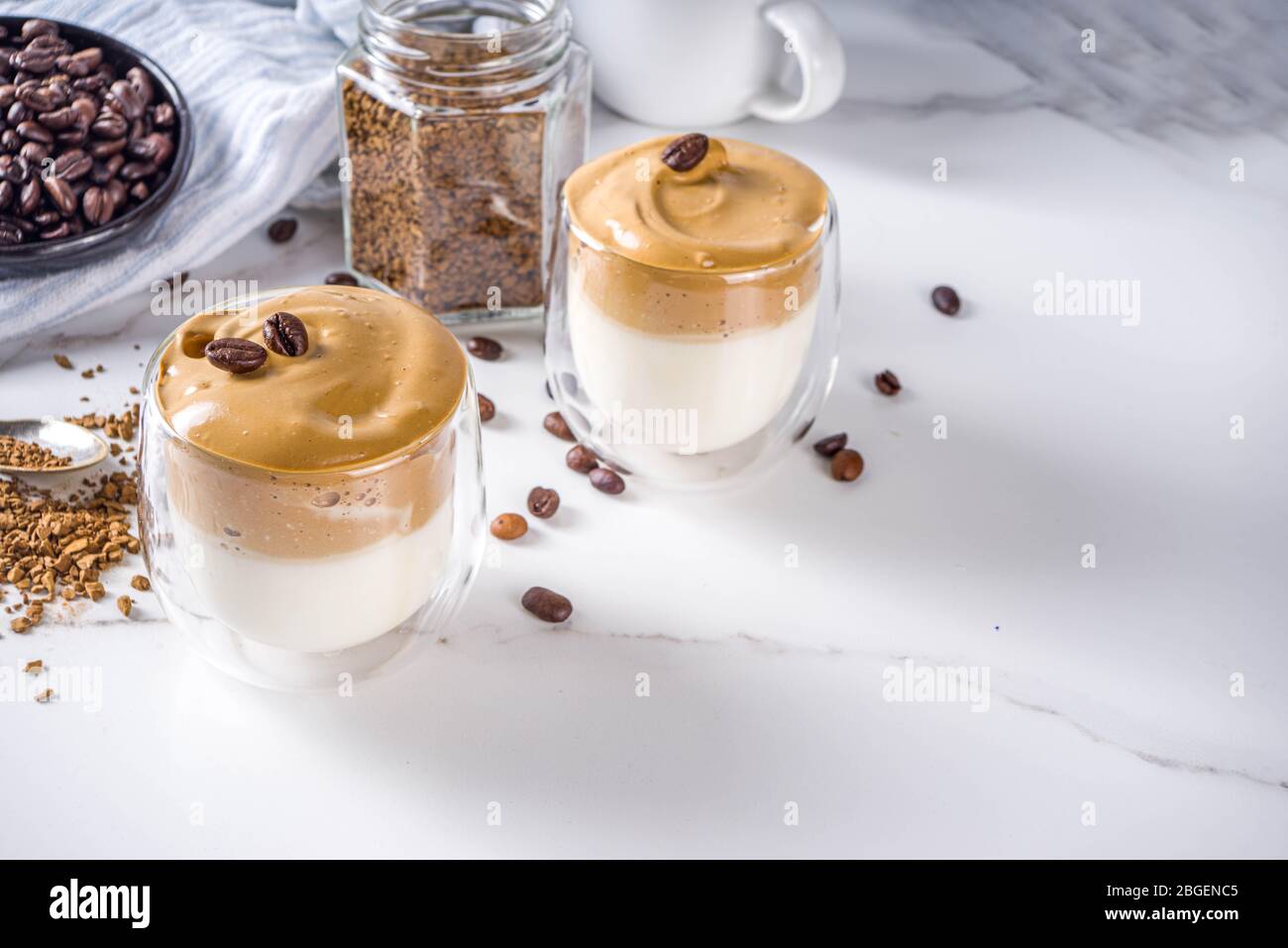 Trendy drink, dalgona coffee. Whipped instant coffee drink with cold ...