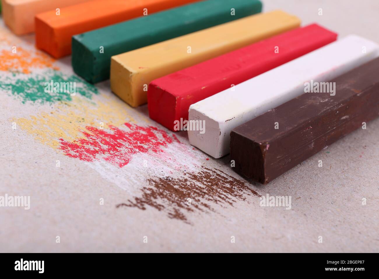 Colorful chalk pastels on color paper background Stock Photo - Alamy