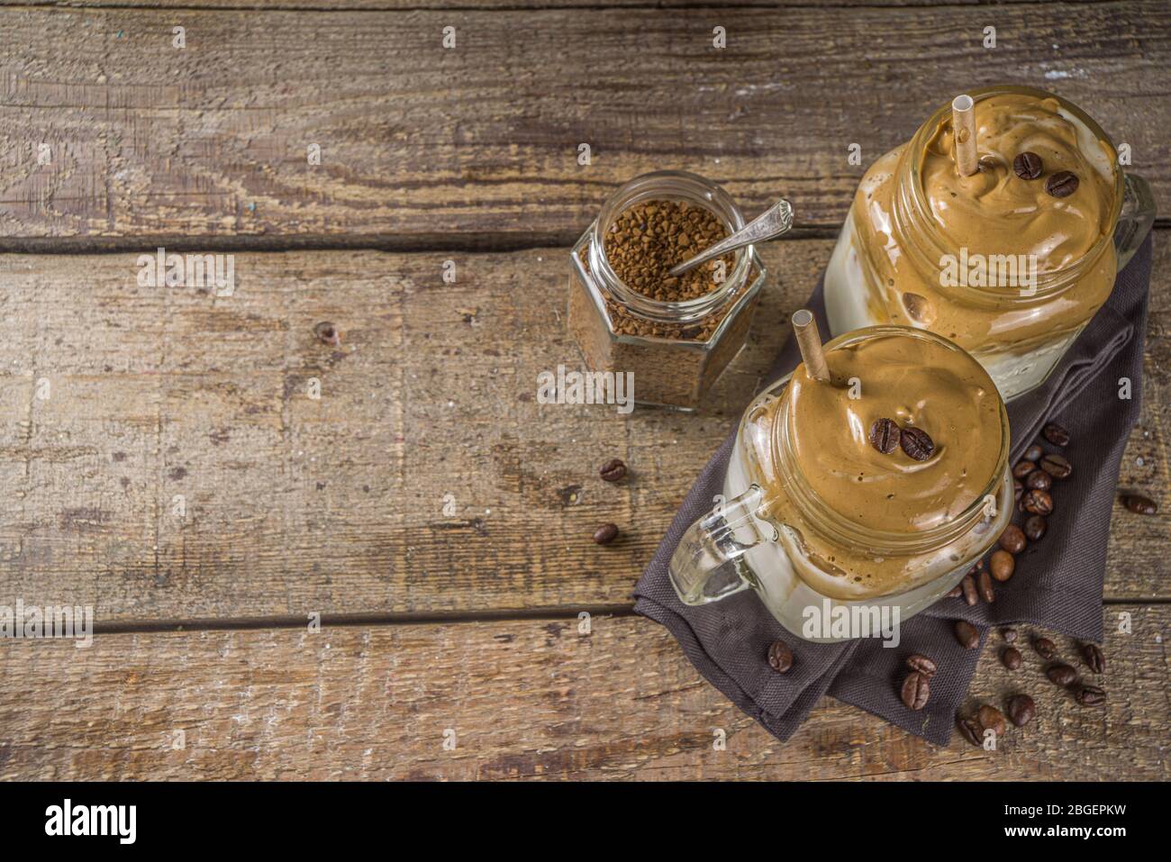 Trendy drink, dalgona coffee. Whipped instant coffee drink with cold ...