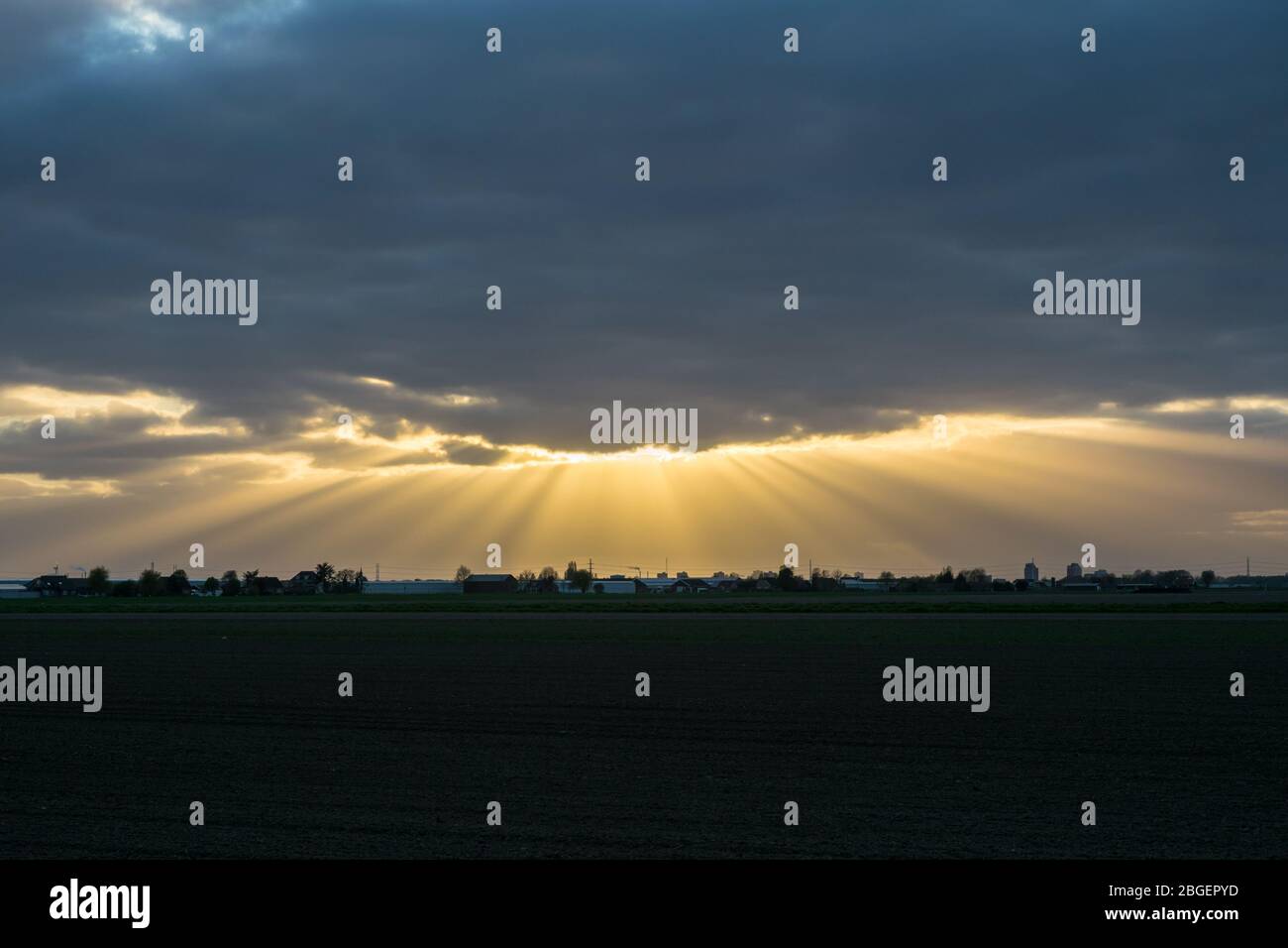 Beautiful beams of light coming from the sun behind the clouds ...