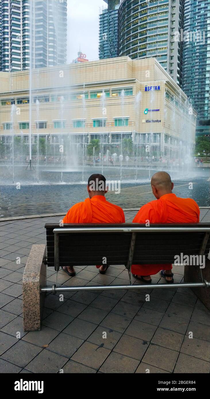 Two monks sit hi-res stock photography and images - Alamy