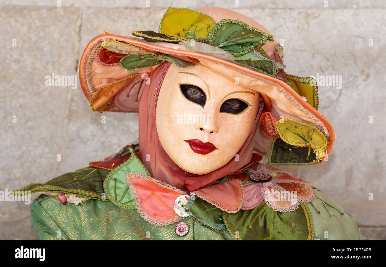 Reveller In Traditional Elaborate Mask And Costume At The Annual Venice ...