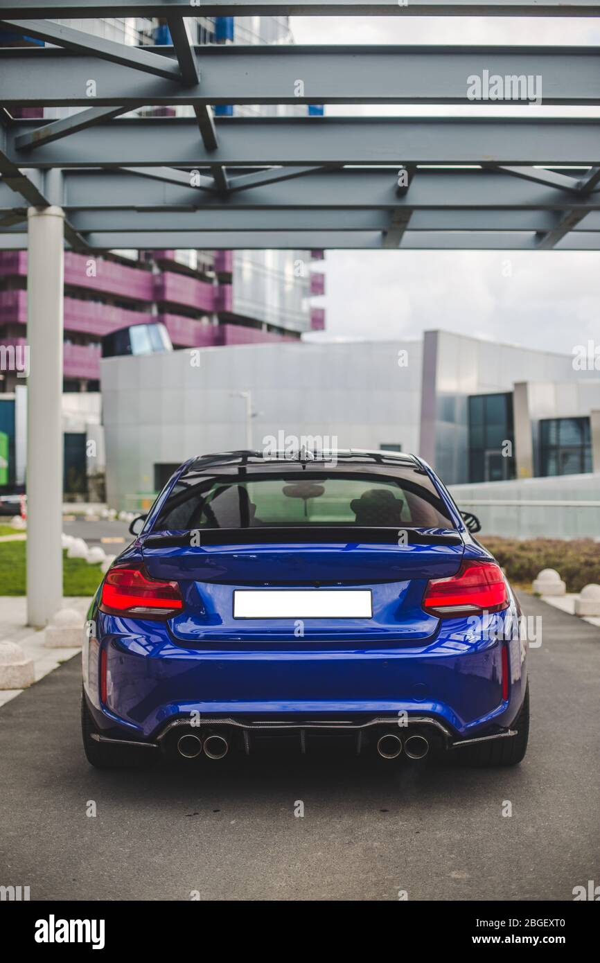 Parking blue sedan outdoor of an office building Stock Photo - Alamy