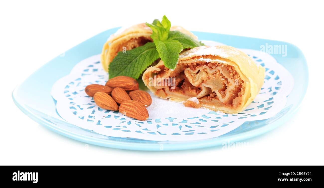 Tasty homemade strudel on plate isolated on white Stock Photo - Alamy