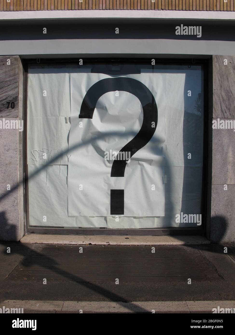 Question Mark symbol on shop front in rome italy Stock Photo - Alamy