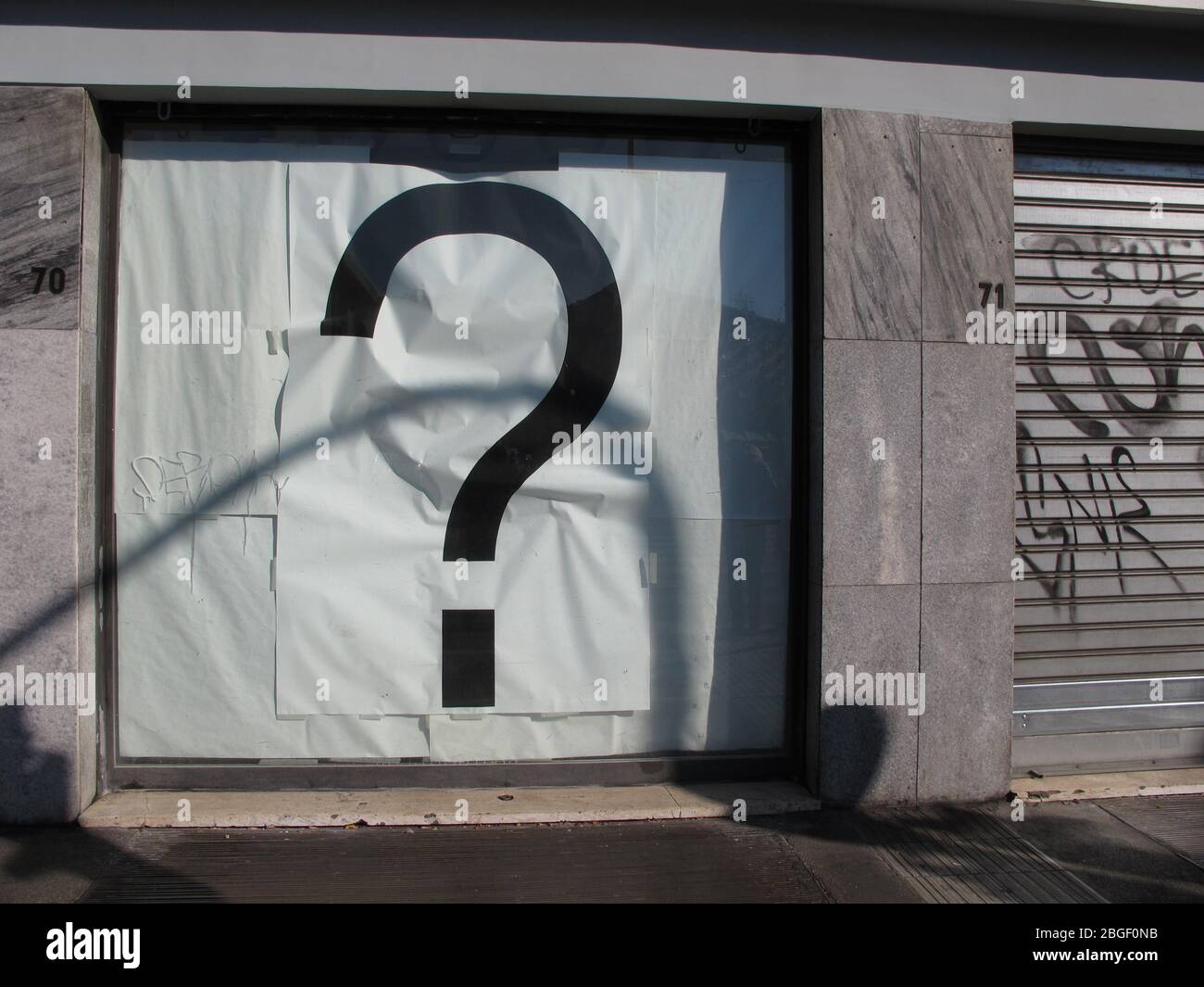 Question Mark symbol on shop front in rome italy Stock Photo - Alamy