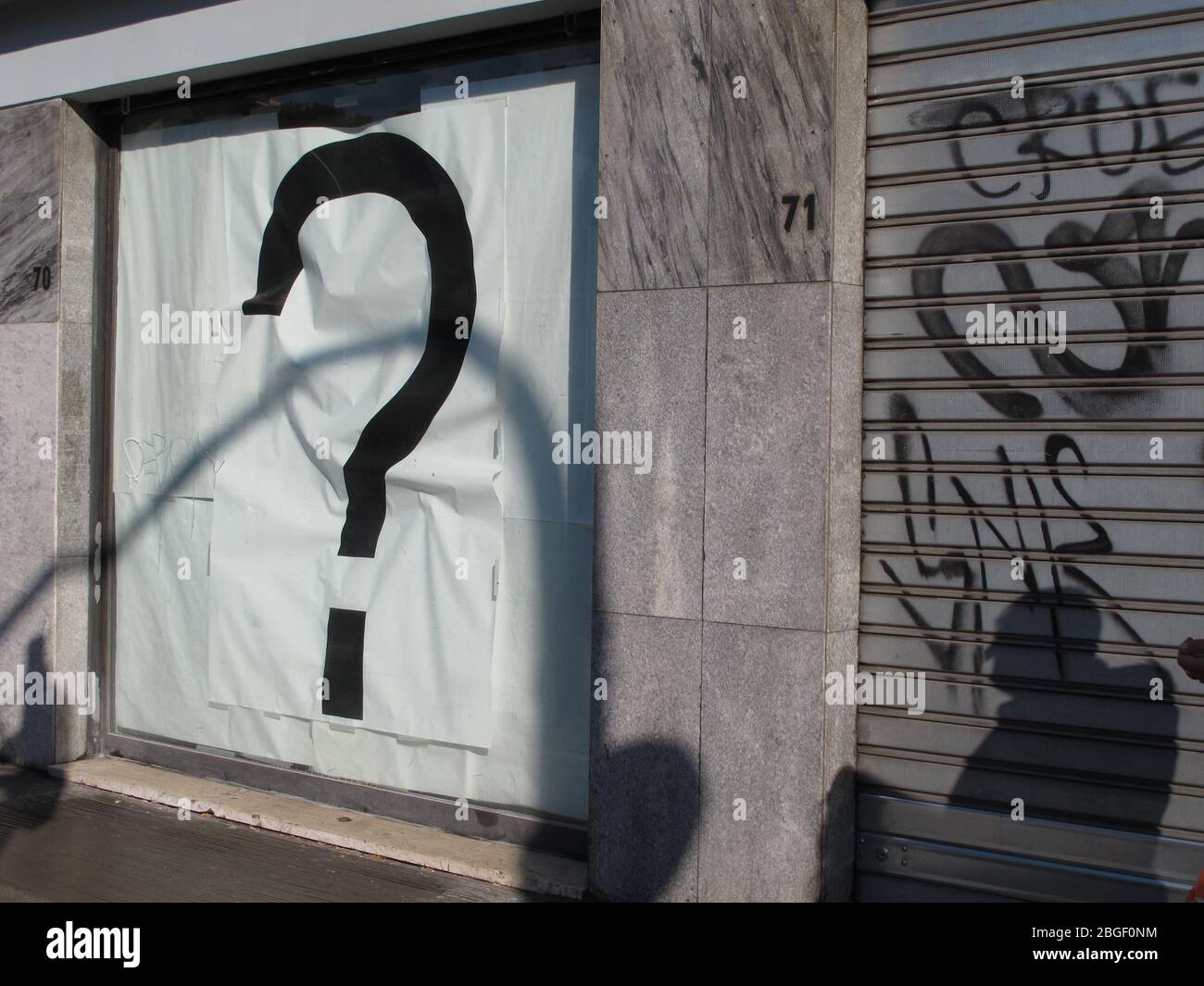 Question Mark symbol on shop front in rome italy Stock Photo - Alamy