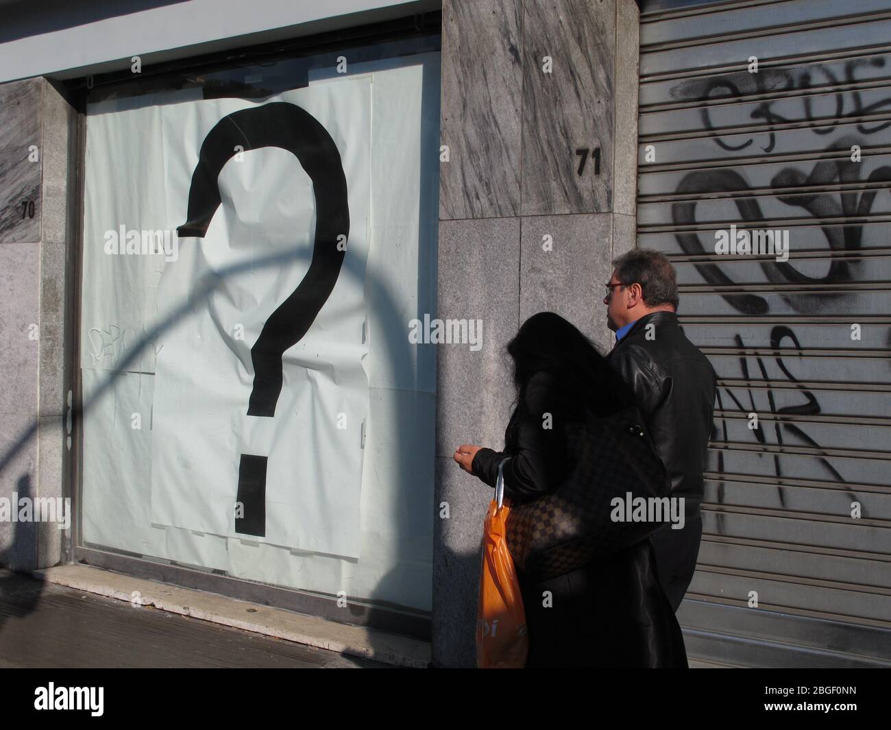 Question Mark symbol on shop front in rome italy Stock Photo - Alamy