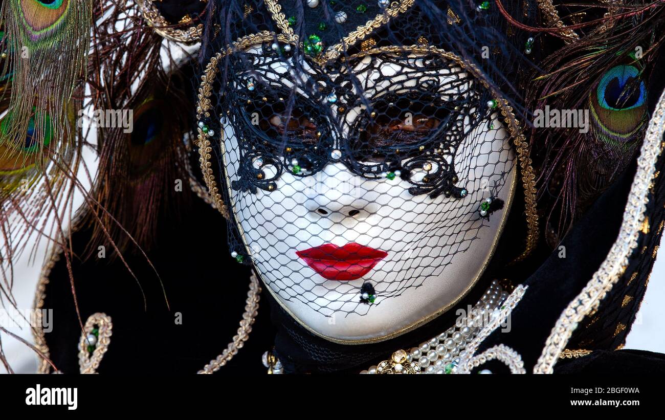 Reveller In Traditional Elaborate Mask And Costume At The Annual Venice ...