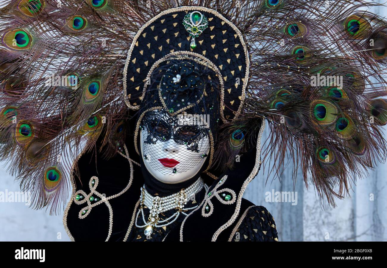 Reveller In Traditional Elaborate Mask And Costume At The Annual Venice ...