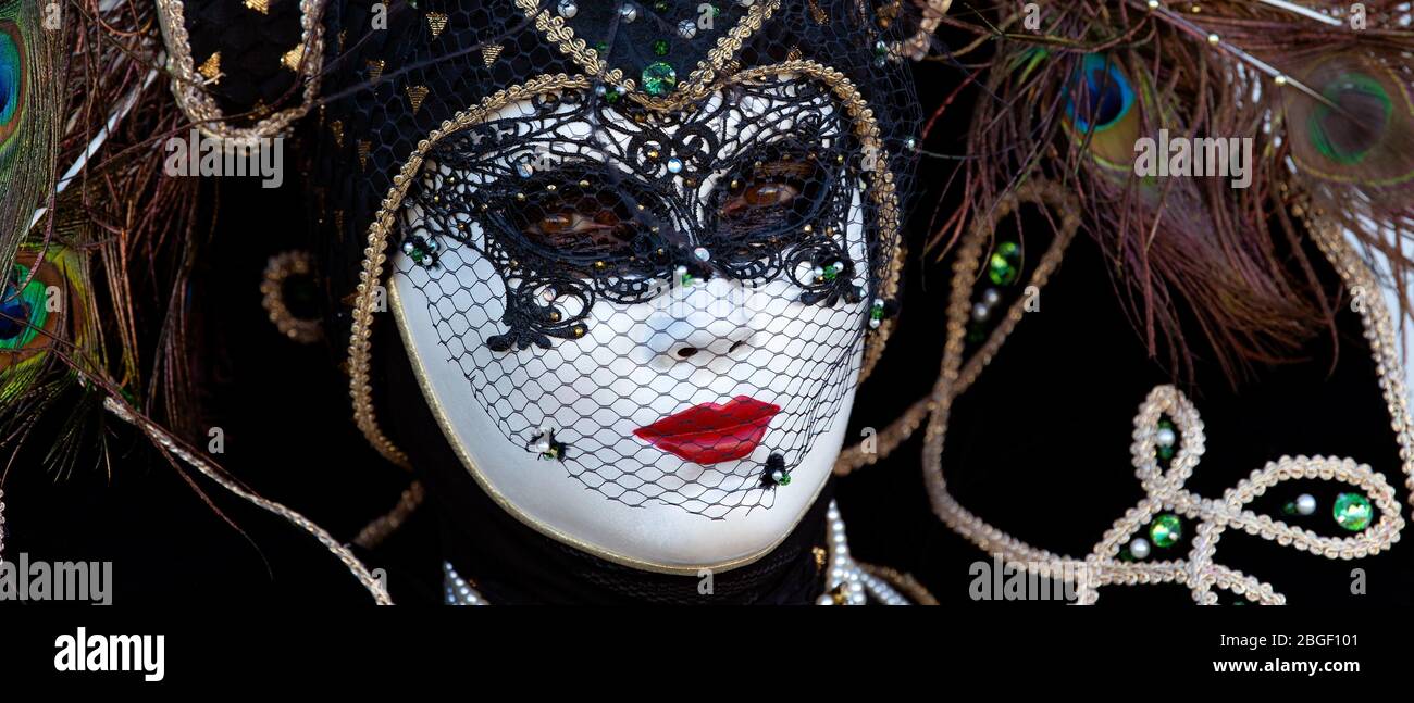 Reveller In Traditional Elaborate Mask And Costume At The Annual Venice ...