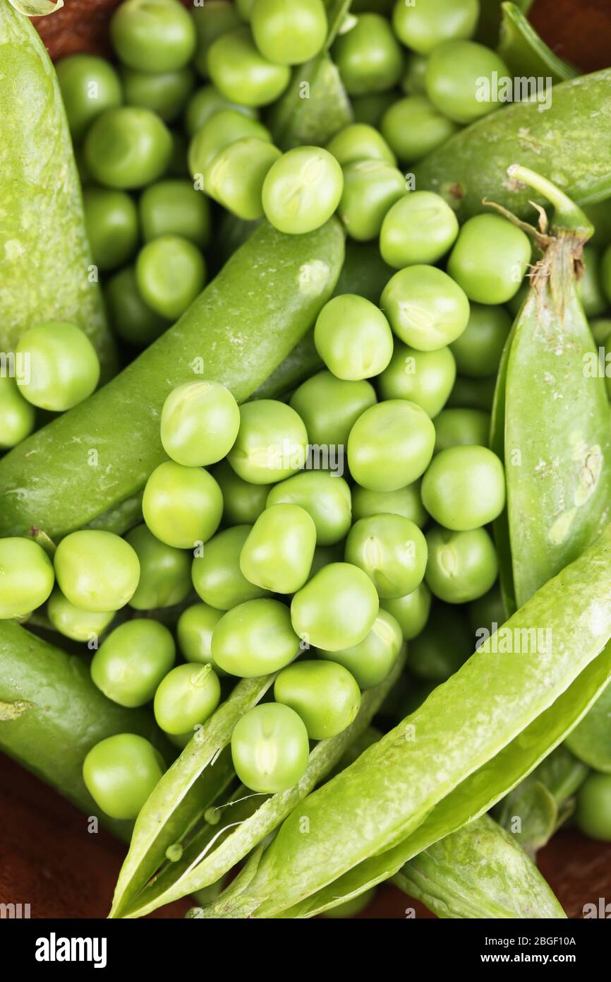 Green peas background Stock Photo - Alamy