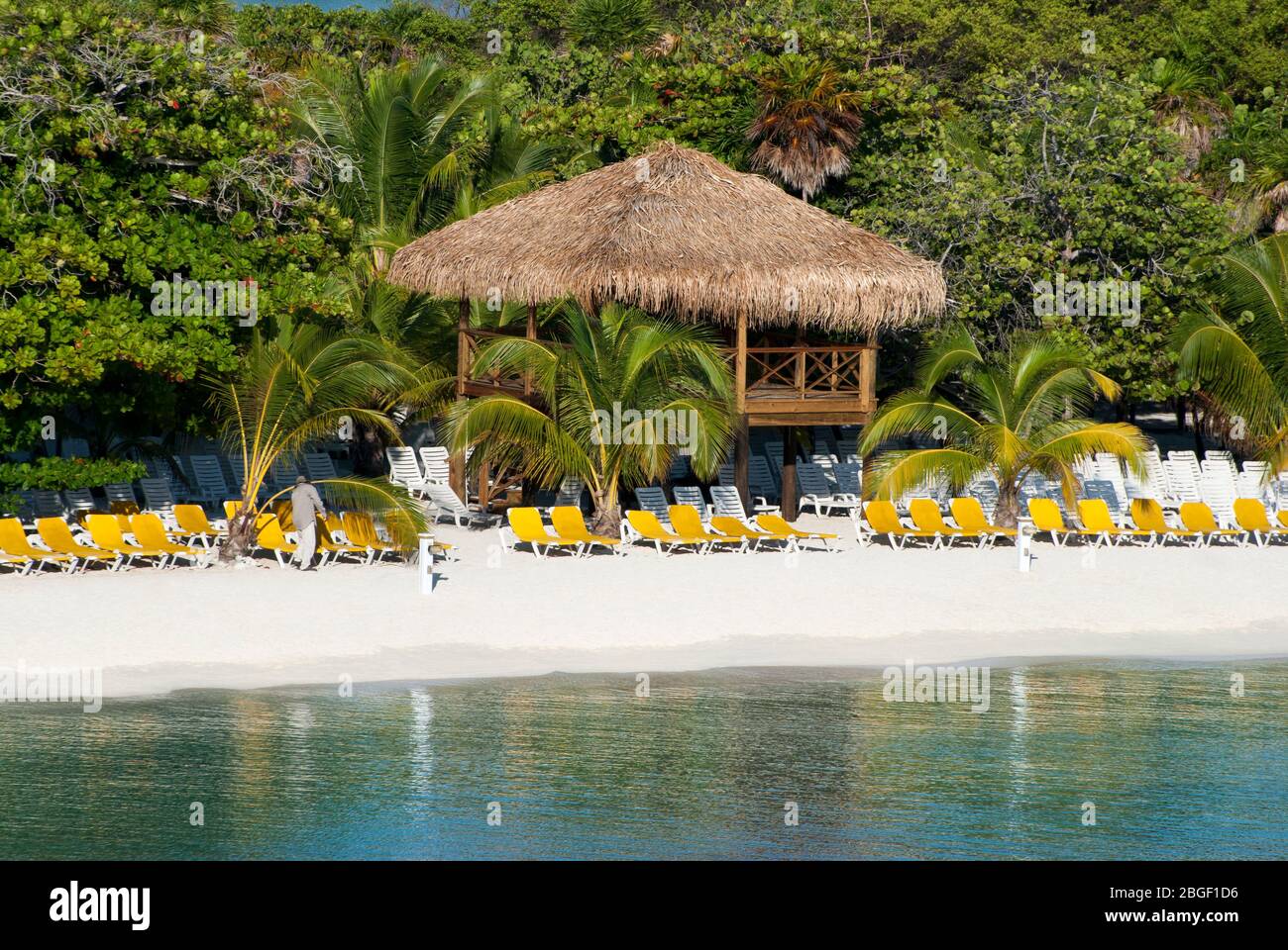 The evening view of an empty Mahogany Bay beach on Roatan Island ...
