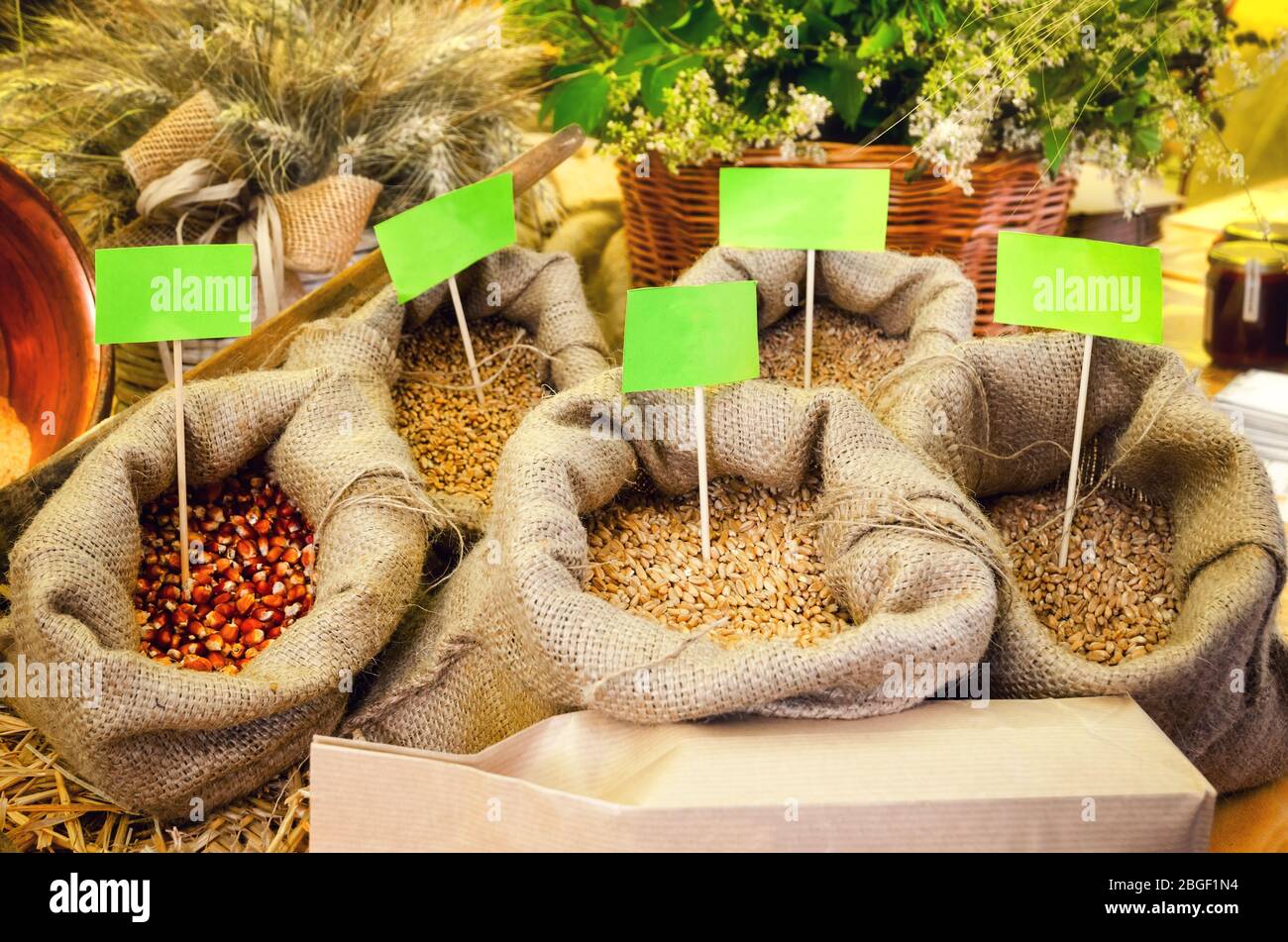 farmer market stall with different cereals: corn, wheat, einkorn wheat ...