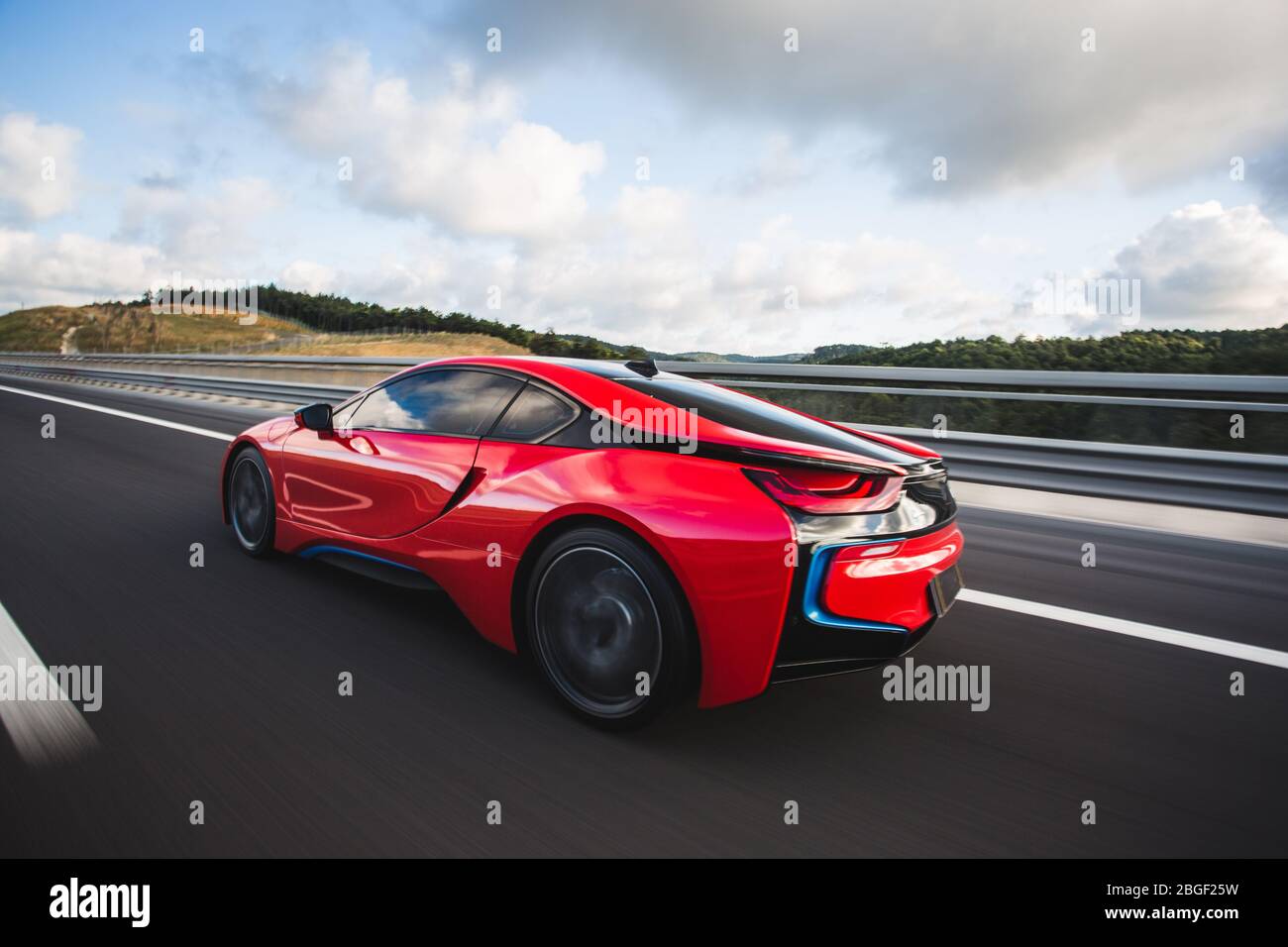 Red modern design car on the highlands driving with high speed Stock ...
