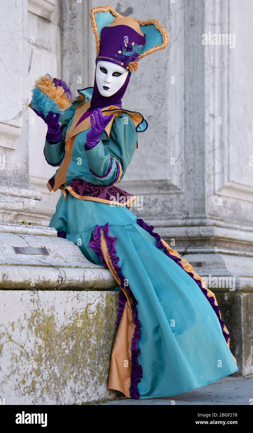 Reveller In Traditional Elaborate Mask And Costume At The Annual Venice ...