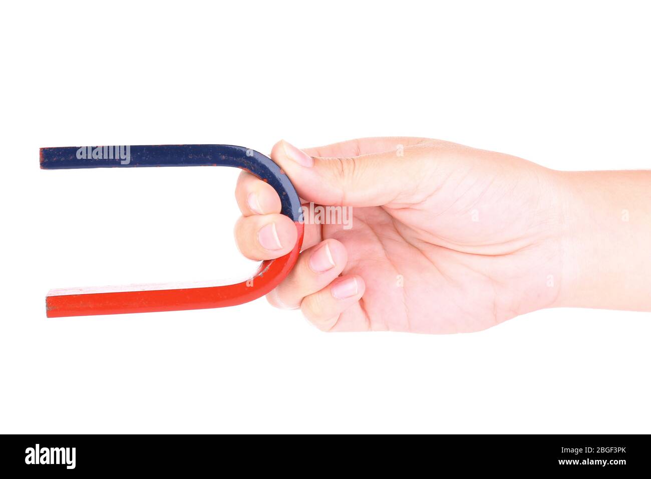 Magnet in hand isolated on white Stock Photo - Alamy