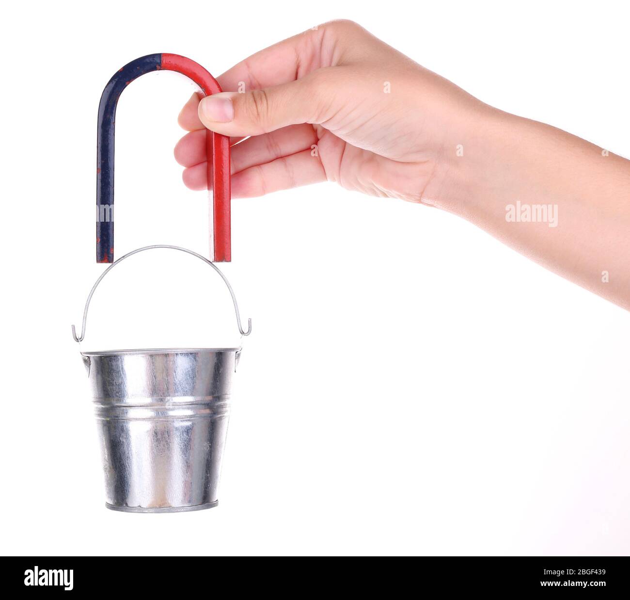 Magnet in hand holding small iron bucket isolated on white Stock Photo ...