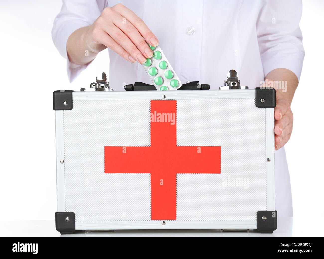 Nurse holding first aid kit, isolated on white Stock Photo - Alamy