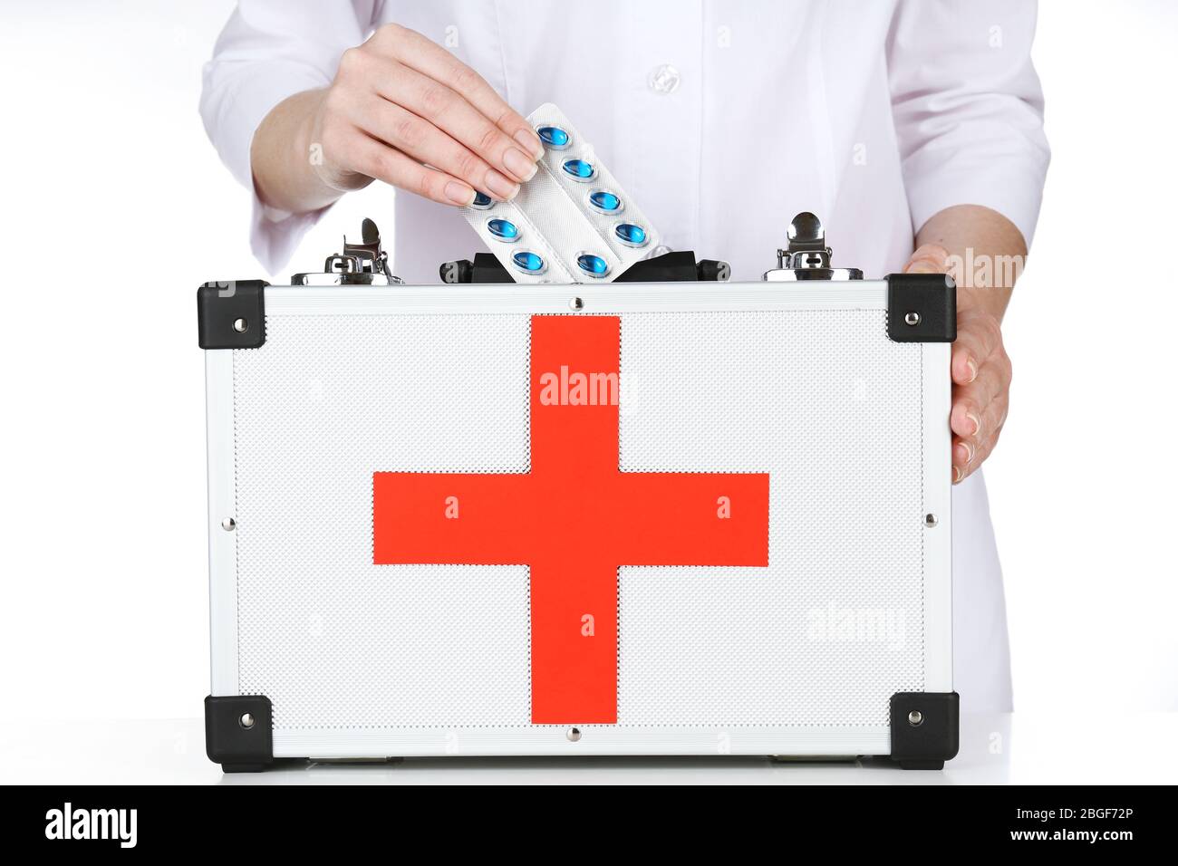 Nurse holding first aid kit, isolated on white Stock Photo - Alamy