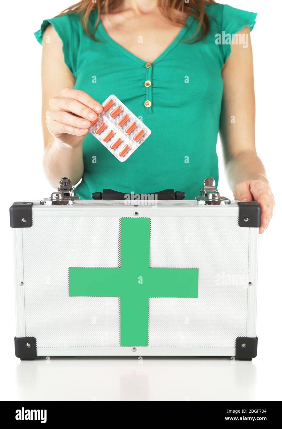 Woman holding first aid kit, isolated on white Stock Photo - Alamy