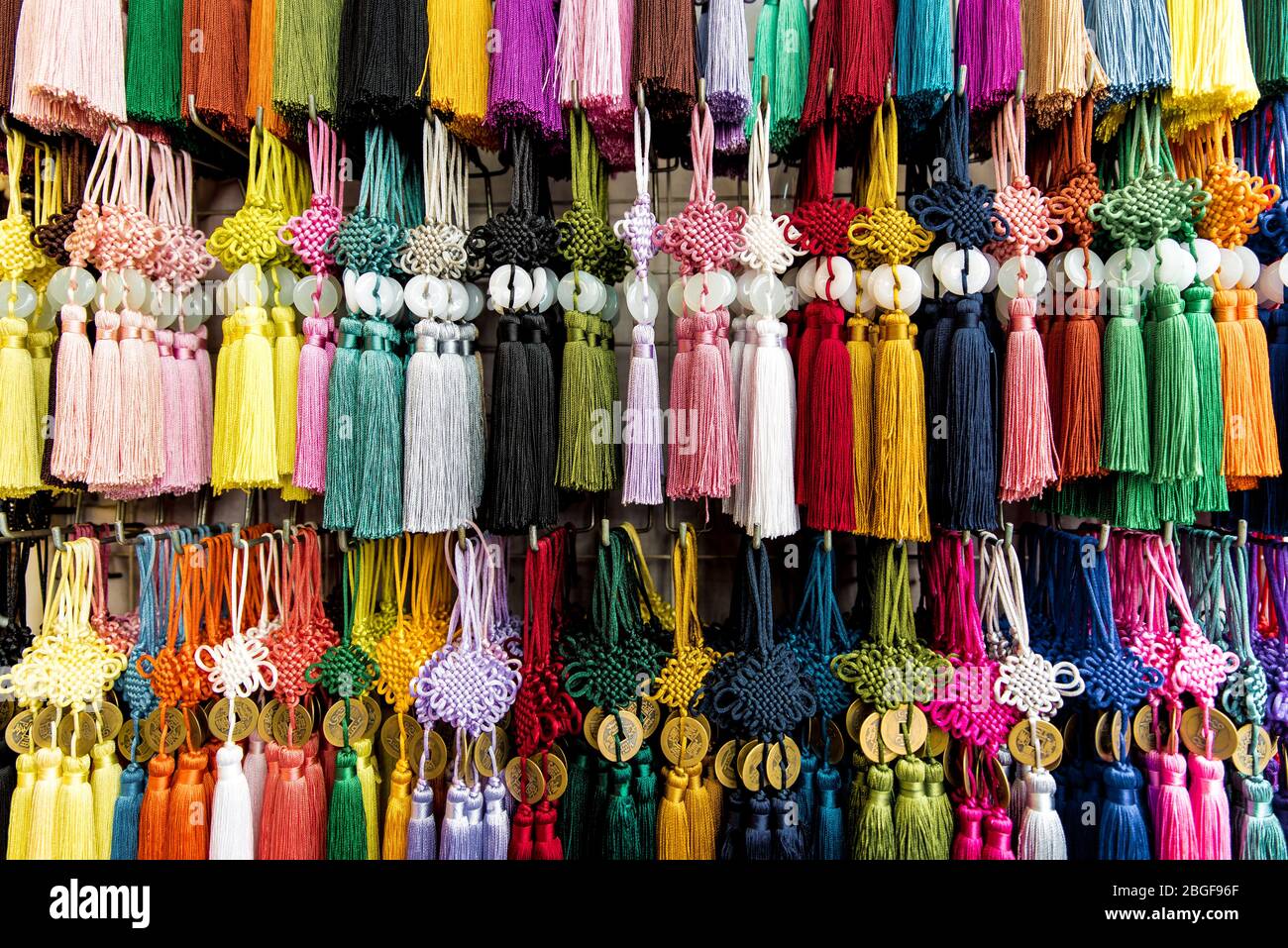 Rows of hand made Chinese lucky charms for sale hanging on street ...