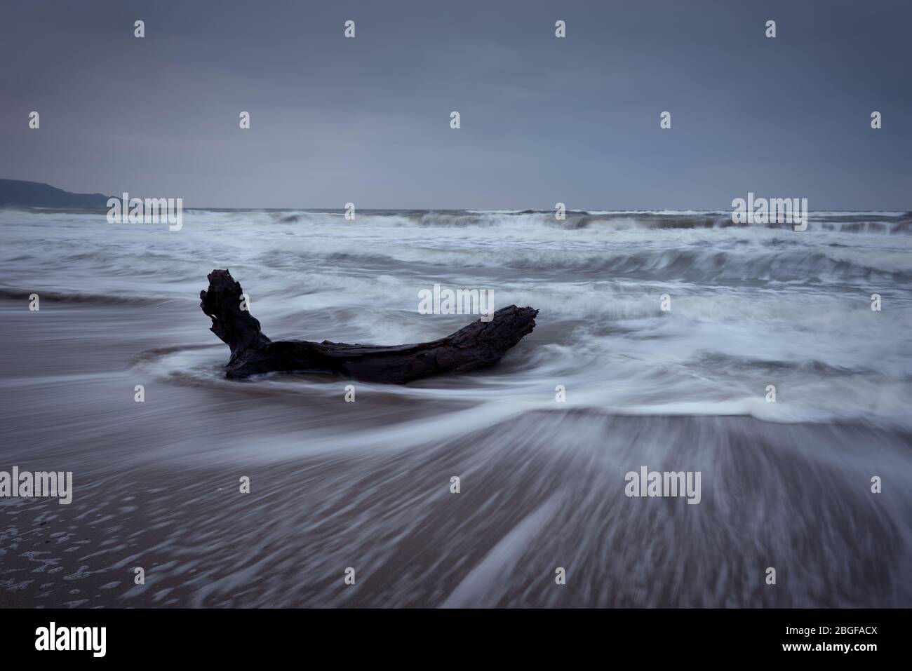Dramatic nature background - big waves and dark rock in stormy sea ...