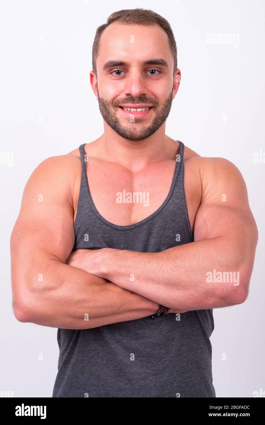 Portrait of happy muscular bearded man smiling with arms crossed Stock ...
