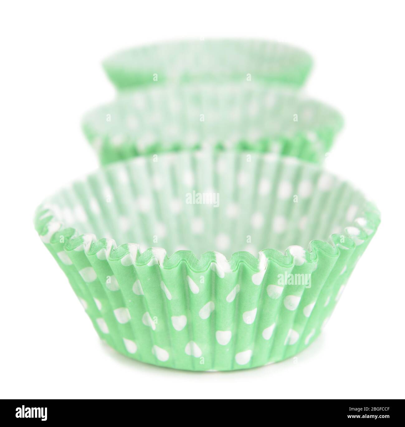 Colorful cupcake wrappers isolated on white Stock Photo - Alamy