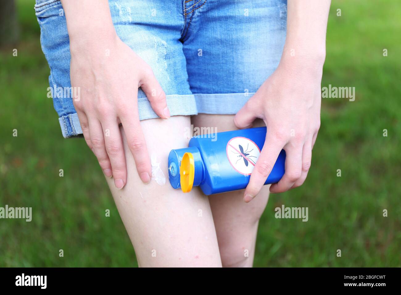 Woman using insecticide spray hi-res stock photography and images - Alamy