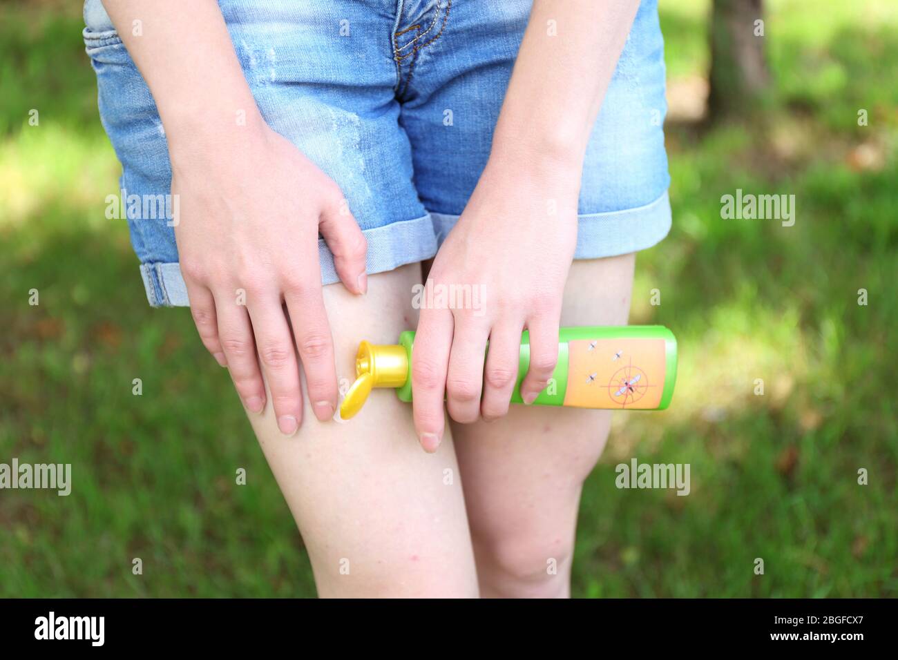 Woman spraying insect repellent on skin, outdoor Stock Photo - Alamy