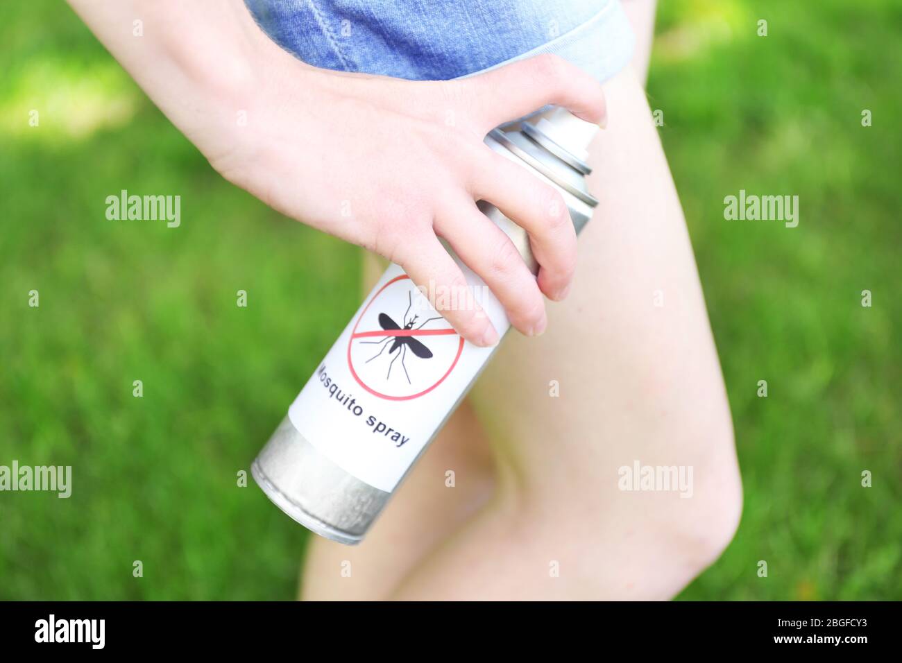Woman spraying insect repellent on skin, outdoor Stock Photo - Alamy