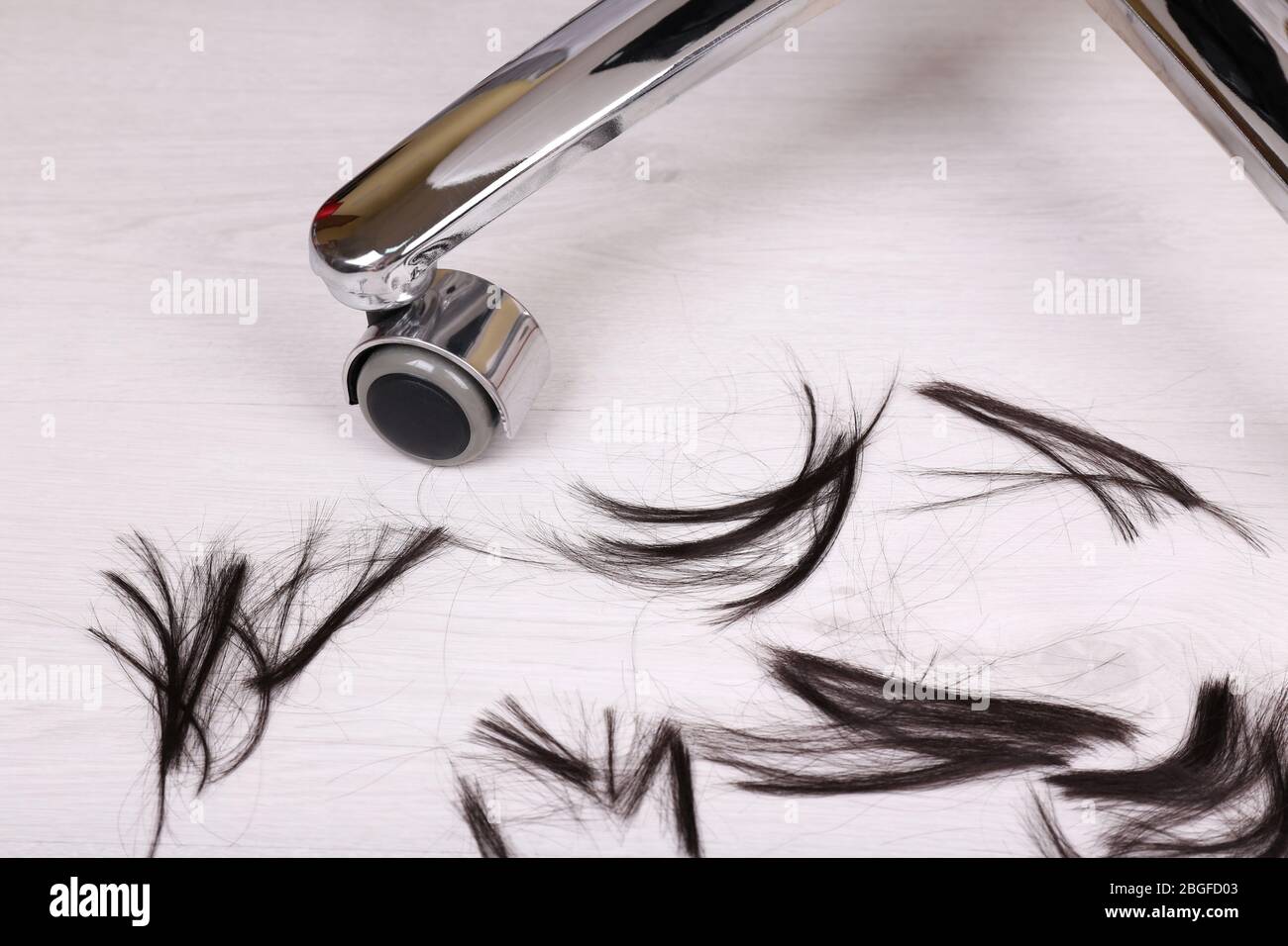 Cut hair on the floor in hairdressing salon, close up Stock Photo - Alamy