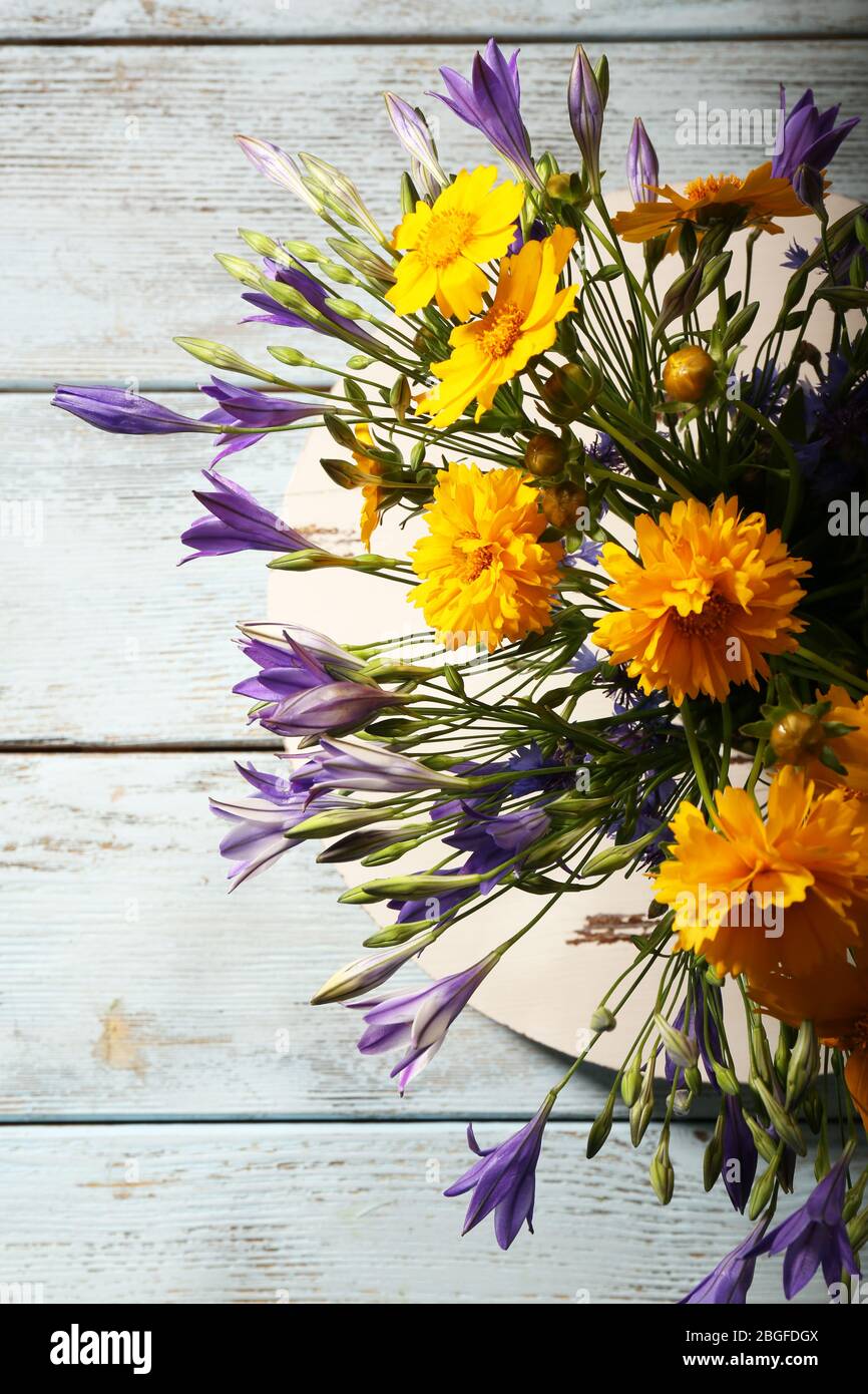 Beautiful wild flowers on table Stock Photo - Alamy