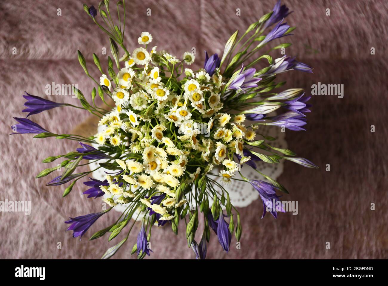 Beautiful wild flowers on table Stock Photo - Alamy
