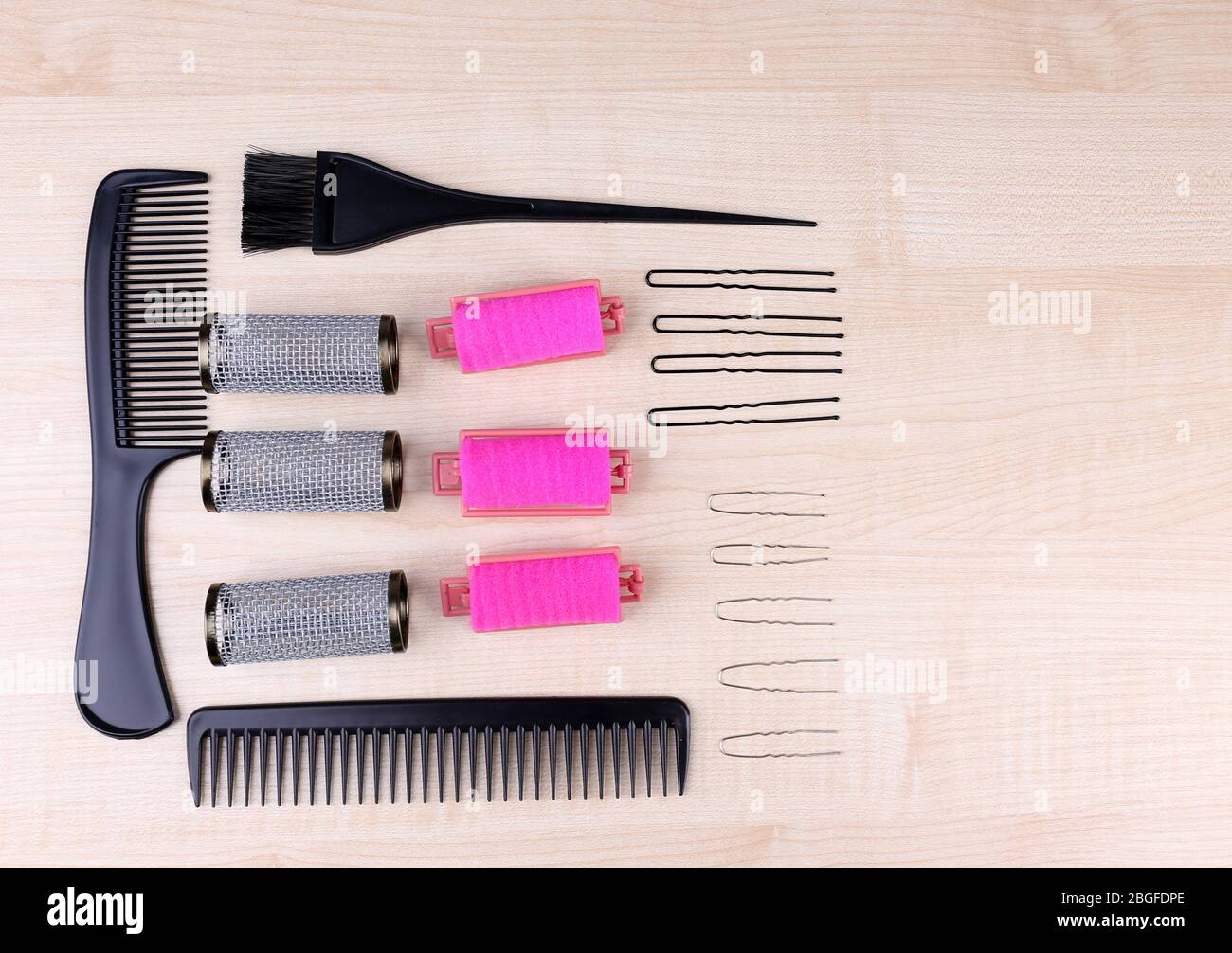 Professional hairdresser tools - comb, scissors and pins on light ...