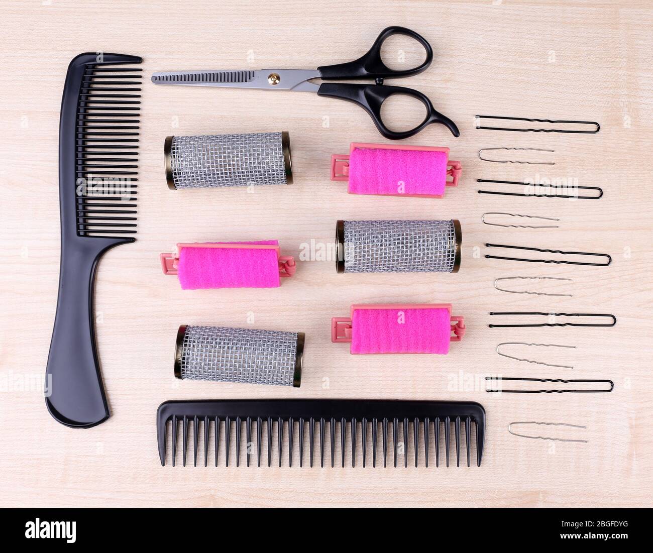 Professional hairdresser tools - comb, scissors and pins on light ...