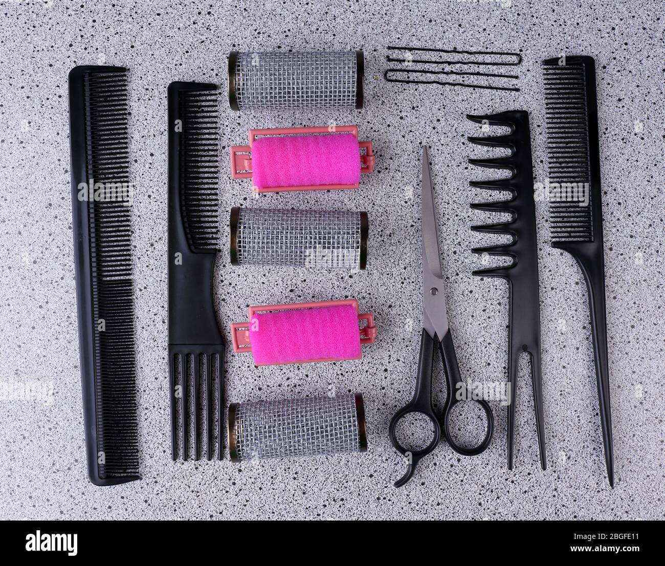 Professional hairdresser tools on gray background Stock Photo - Alamy
