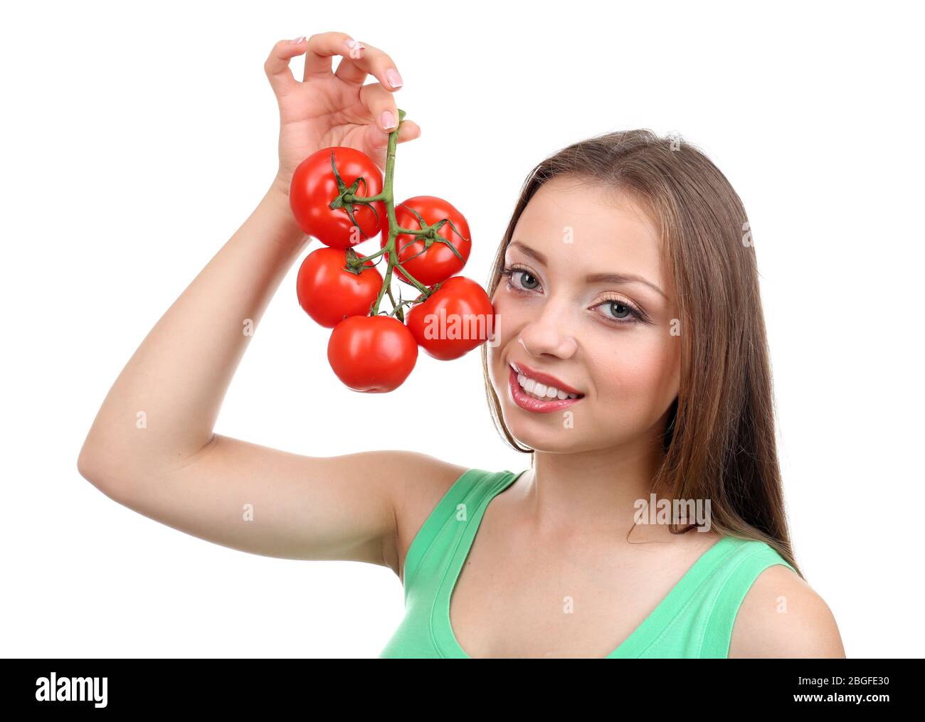 Beautiful girl with tomato, isolated on white Stock Photo - Alamy