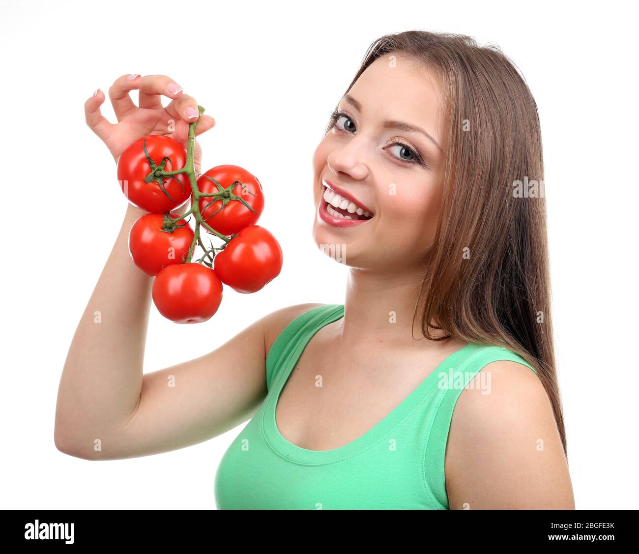 Beautiful girl with tomato, isolated on white Stock Photo - Alamy