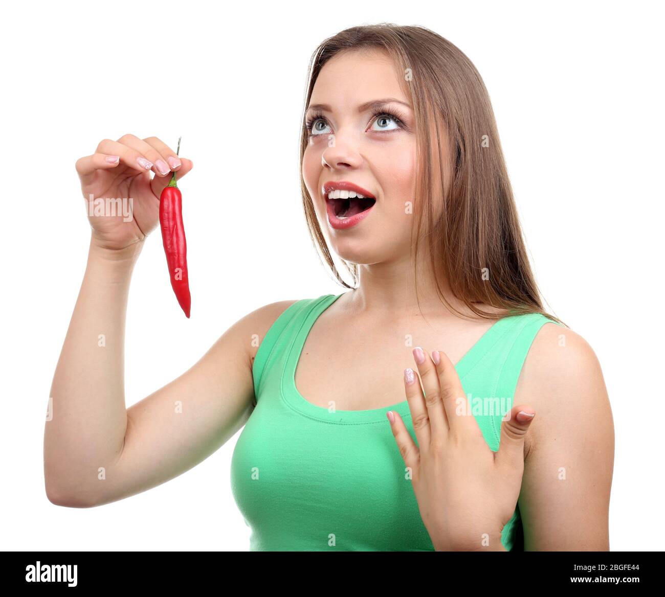 Beautiful girl with chili pepper, isolated on white Stock Photo - Alamy