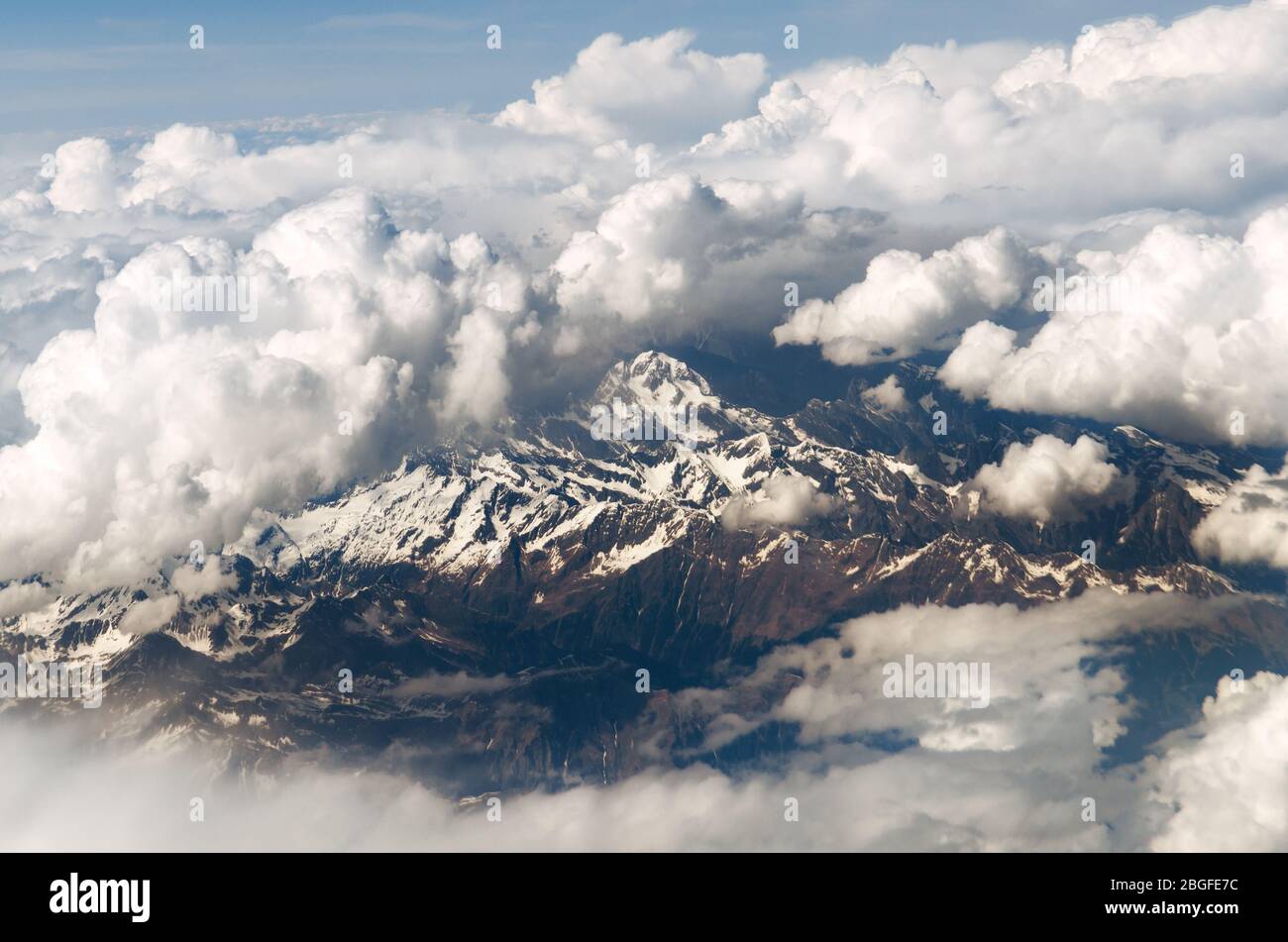 Austrian Alps mountains seen from an airplane window Stock Photo - Alamy