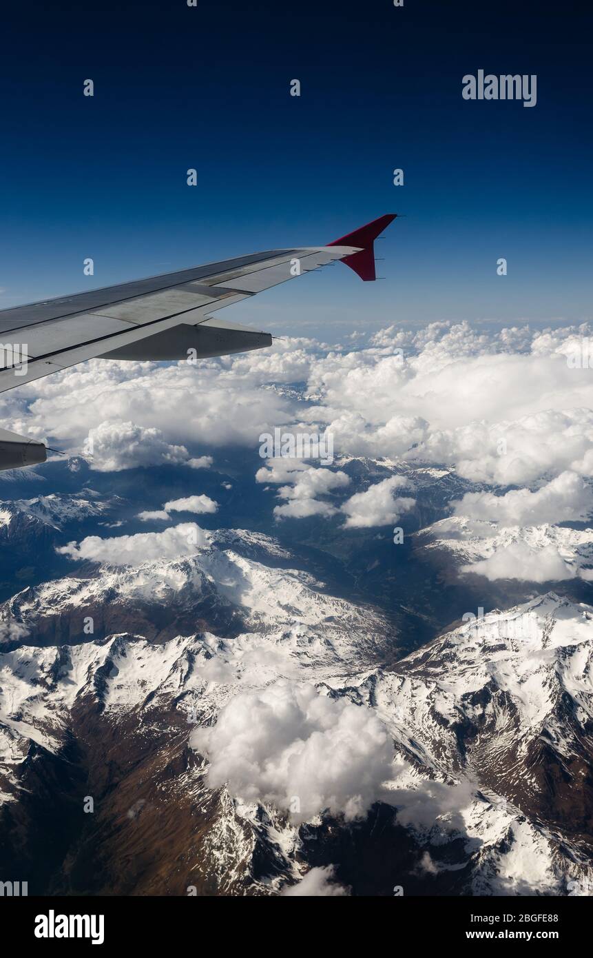 Austrian Alps mountains seen from an airplane window Stock Photo - Alamy